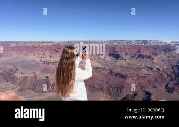 A woman is capturing stunning and breathtaking views of the Grand ...