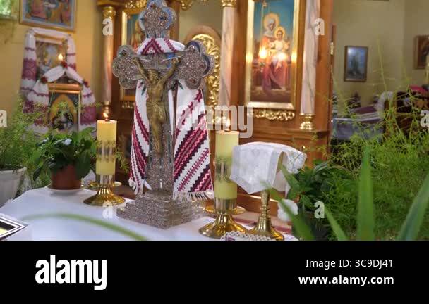 A cross with a crucifix is installed on the altar in the church Stock ...