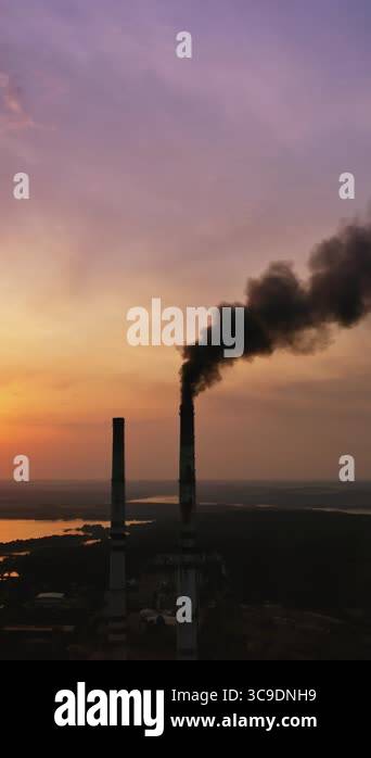Air pollution smog from factory. Aerial drone view of factory during ...