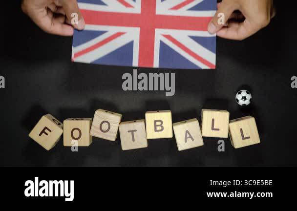 Union Jack flag with football title. football concept Stock Video ...