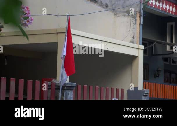 There is a red flag on housing area Stock Video Footage - Alamy