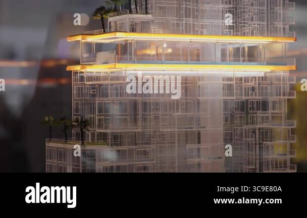Miniature skyscraper model with illuminated pools and balconies. Real ...