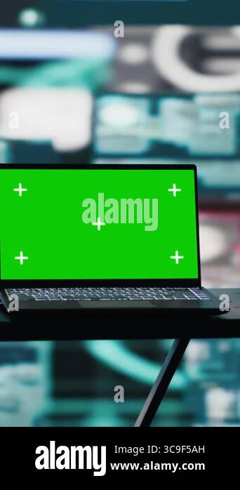 Vertical Video Empty scene with green screen on laptop showcases ...