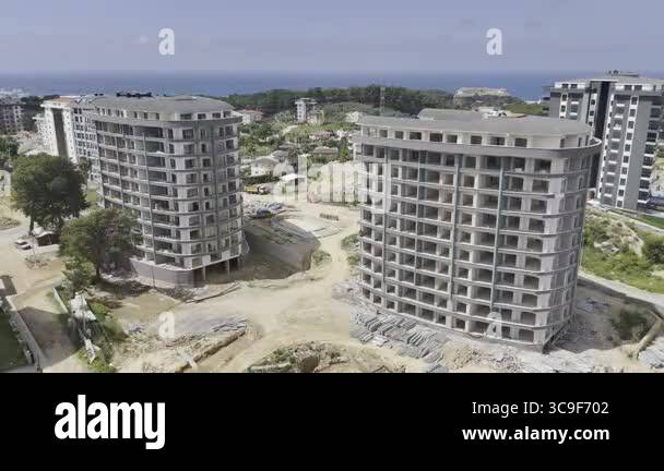 Unfinished concrete building. Tall building construction.Construction ...