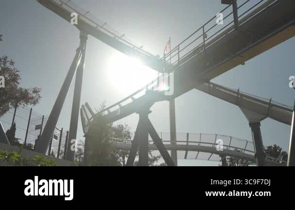 Visitors enjoy exciting rides at Sea World while basking in the bright ...
