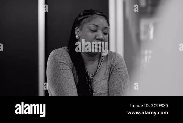 Woman sitting in silence after emotional release, reflecting on pain ...