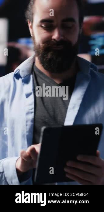 Vertical Video Young modern person focused on his smartphone app and ...