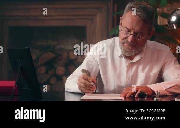 Aged old Caucasian man writing paper document paperwork male business ...