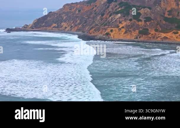 Aerial telephoto shot of Flat Point Beach and Flat Point Rock, Palos ...