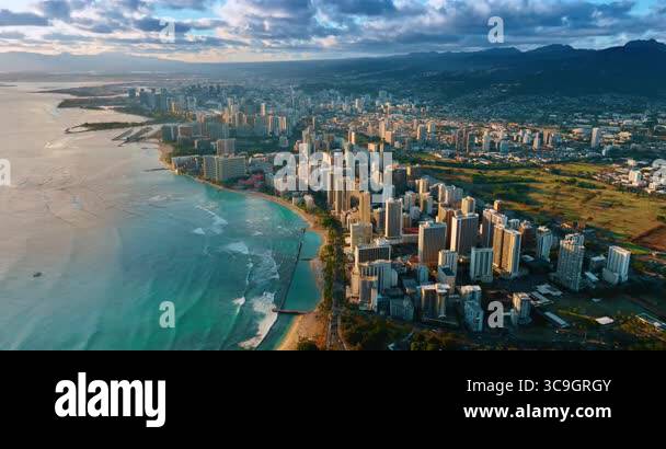 Waves slowly roll to the sandy beach of Waikiki, Honolulu, Oahu, Hawaii ...