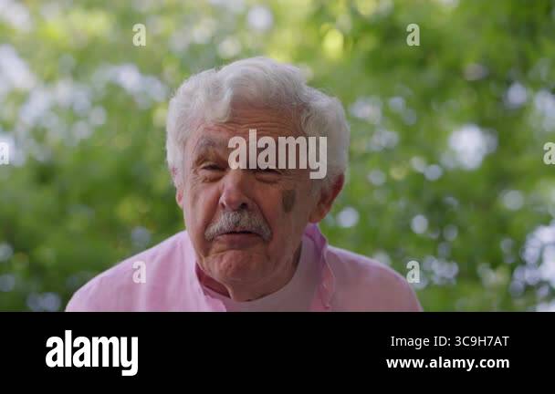 Cheerful retired man from Madrid, once a math professor, leans forward ...