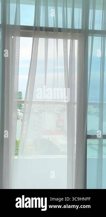 Sheer white curtain Transparent white curtain tulle moves from the wind ...