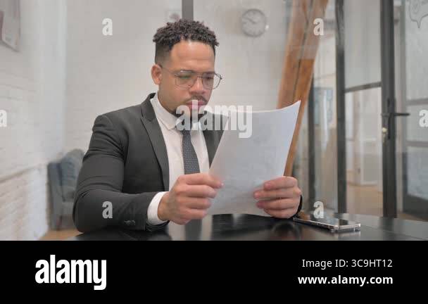 Multiracial Businessman Celebrating Business Report Stock Video Footage - Alamy