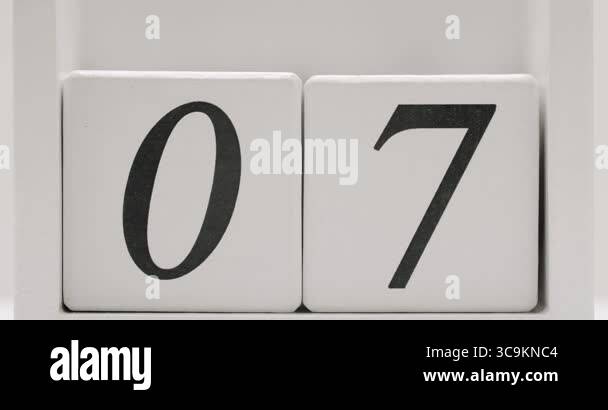 A close-up photograph of calendar blocks displaying the number seven in ...