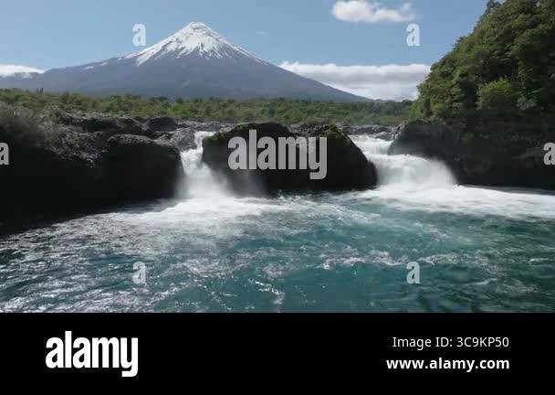 River Rapids Through Forest and Volcanic Rocks in Chile Petrohue ...