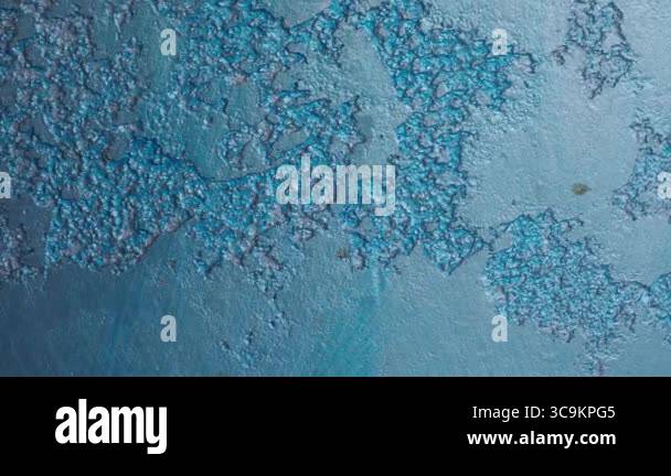 Close-up reveals intricate blue paint patterns on a surface Stock Video ...