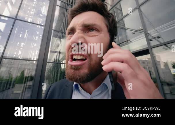 Angry mad business man yelling talking mobile phone call in city mad ...