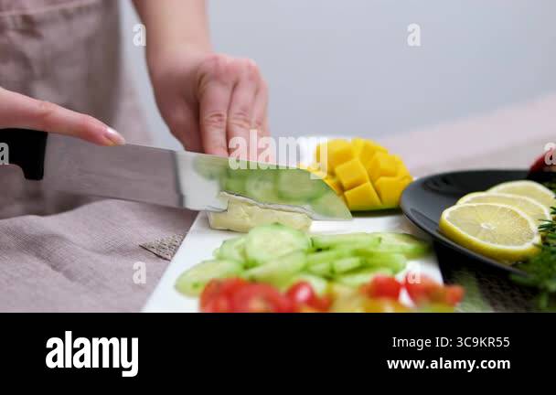 slice brie cheese mango detailed view of hands slicing fresh vegetables ...