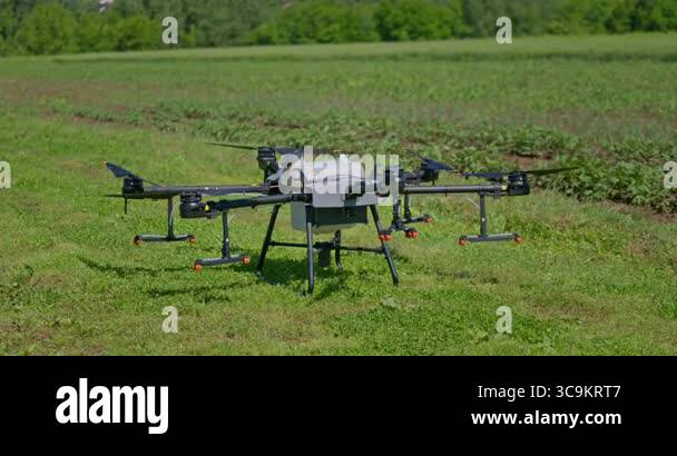 Aerial drone flying over a cultivated farm field during a crop ...