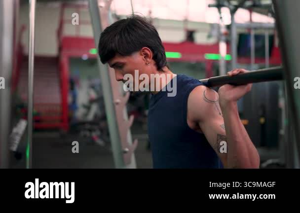 Young male athlete lifting barbell in gym Stock Video Footage - Alamy