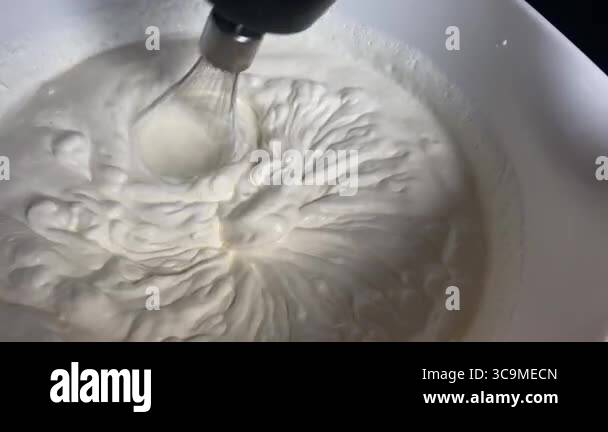 The mesmerizing process of whipping cream to perfection with an ...