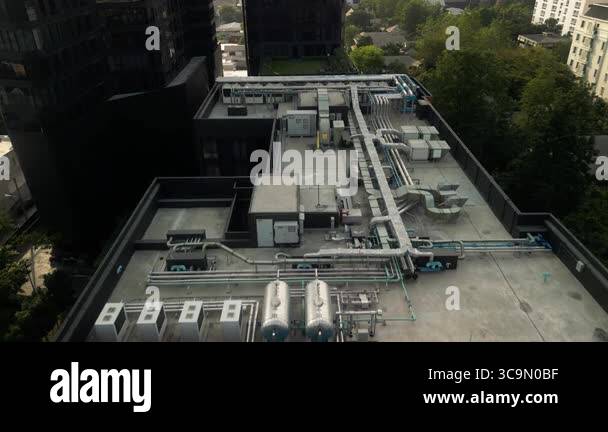Top-down view of a building rooftop with complex HVAC system ...