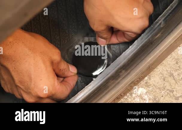 The tire repair process shows specialized tools for precise and efficient maintenance tasks ...