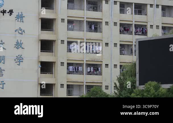 Exterior view of a school dormitory building, fixed camera shooting ...