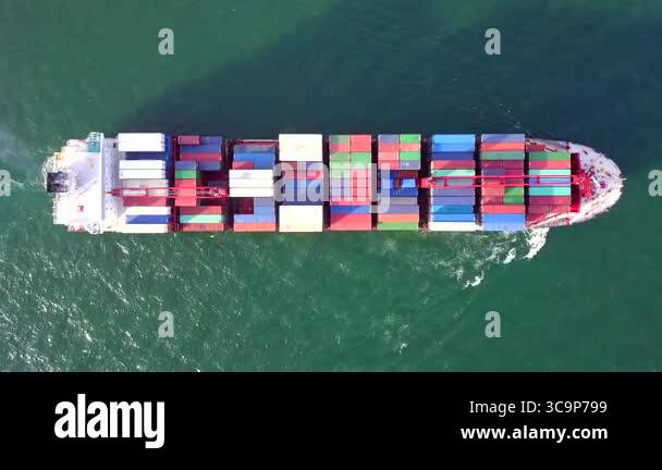 cargo ship loaded with containers sailing at sea delivering goods to ...