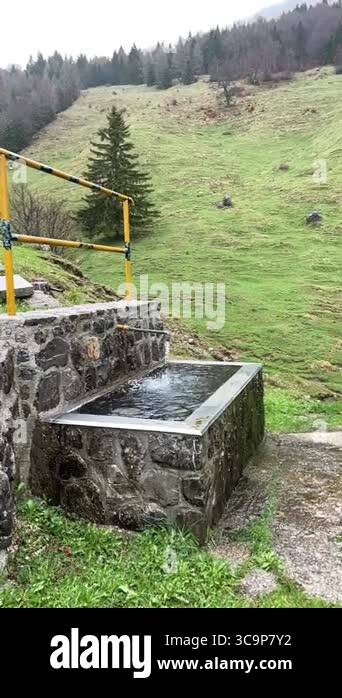 outdoor tap water in the yard among mountains. High quality 4k footage ...