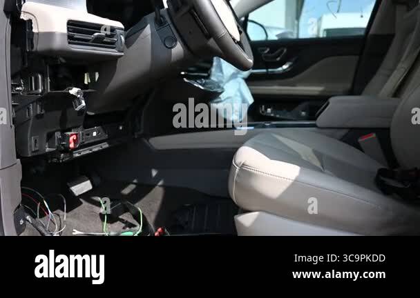 Deployed airbag in car after accident. Interior view of a damaged car ...