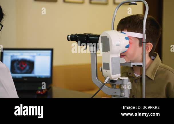 Skilled ophthalmologist performing comprehensive pediatric eye ...