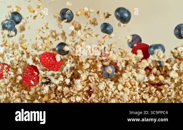 Super Slow Motion of Flying Breakfast Cereals with Berries up in the ...