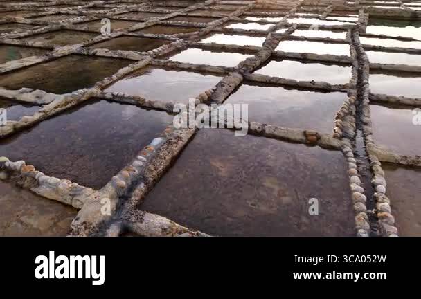 Experience the stunning aerial view of the historic salt pans of Malta ...