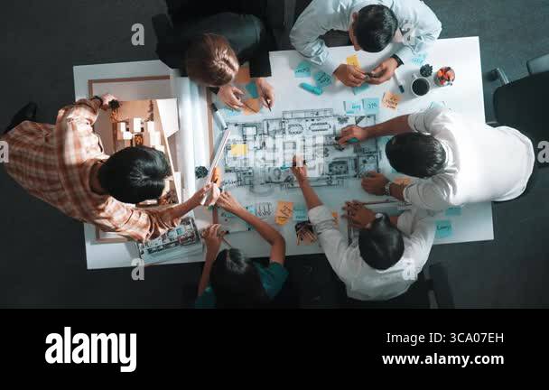 Top aerial view of project manager or civil engineer writing at ...