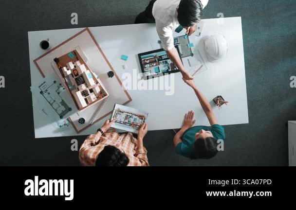 Top view of architect engineer working together and shaking hand ...