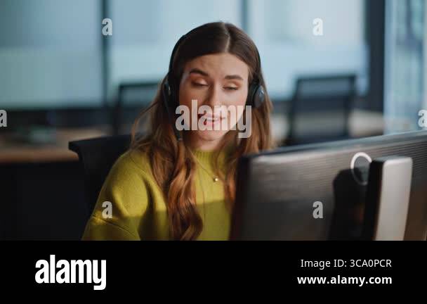 Smiling operator speaking computer in data center closeup. Joyful woman ...
