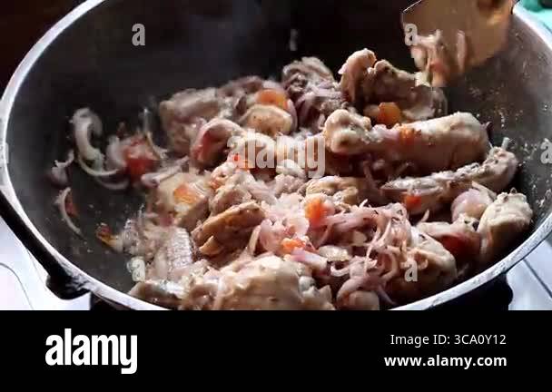 Delicious Irani Chicken Karahi (Kadai Bhuna) curry stirred with spatula ...