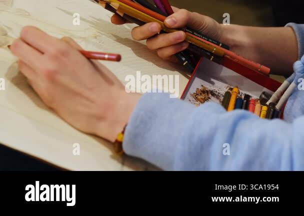 Student uses colored pencil techniques creating large sketch. Artist ...