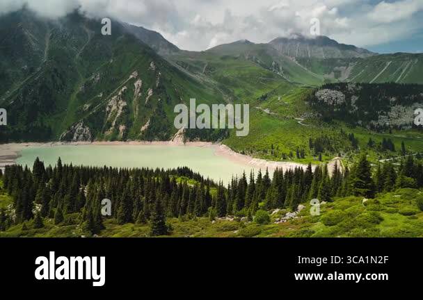 Beautiful aerial drone scenery of the mountain lake and green hills ...