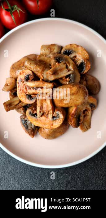 Food, baked mushrooms champignon slices with sauce and spices ...