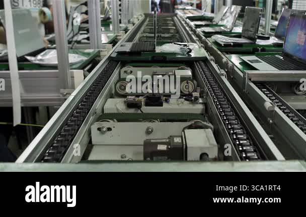 Laptops Moving along a Conveyor Belt in the Laptop Factory. 4K ...