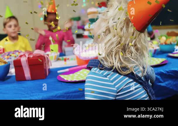 Children clapping with confetti bursting and boy waving at birthday ...