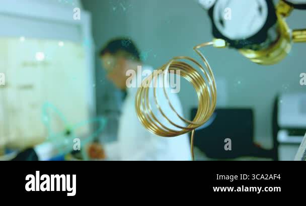 Coil focus shifting to scientist monitoring reaction in chemistry lab ...