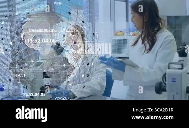 Scientists using tablet and microscope in research lab, displaying ...