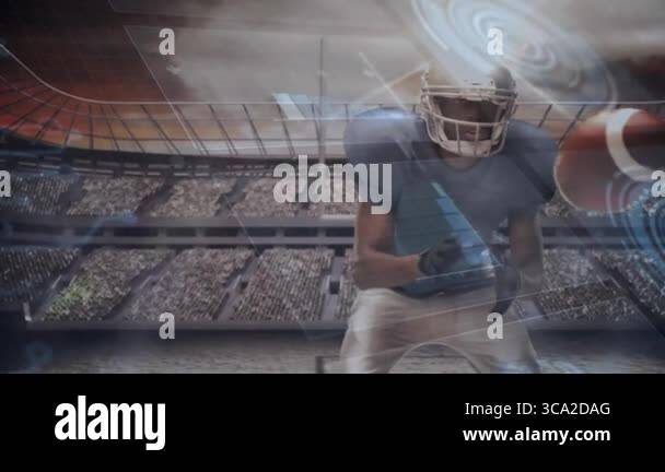 Quarterback catching incoming football as defender lunging tackling ...