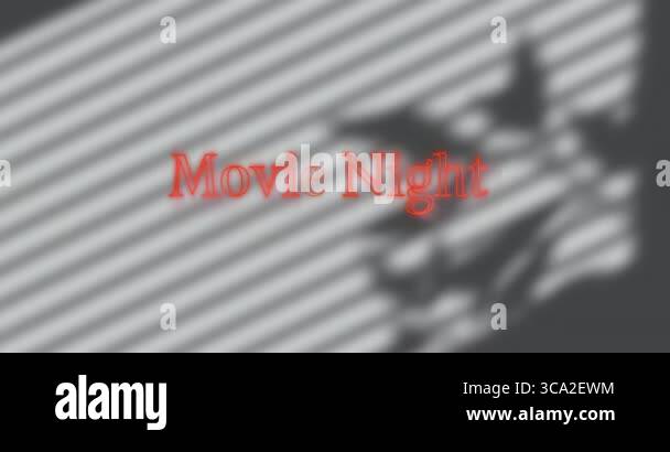 Red serif Movie Night text glowing on blurred striped background ...