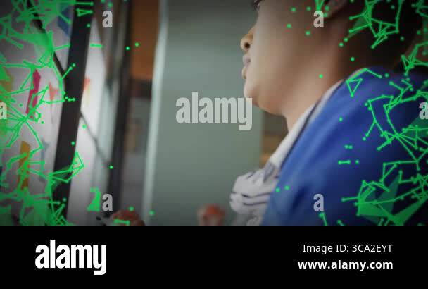 Business team pointing at wall display in modern office, featuring ...