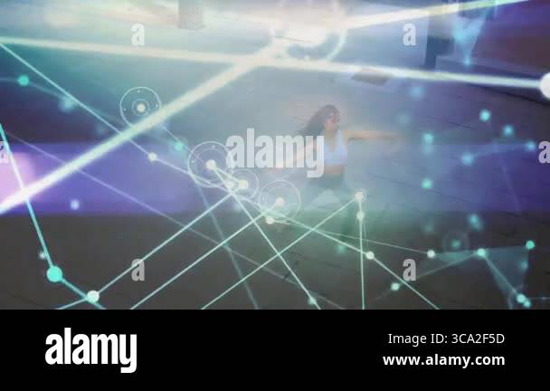 woman spinning on plaza at night, showing animated holographic streaks ...