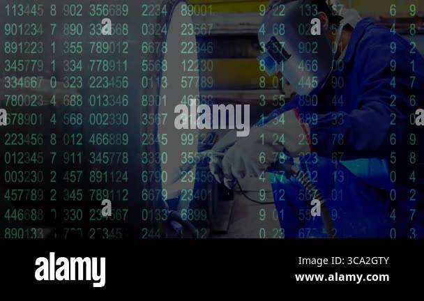 Welder using torch in industrial workshop, with animated green data ...